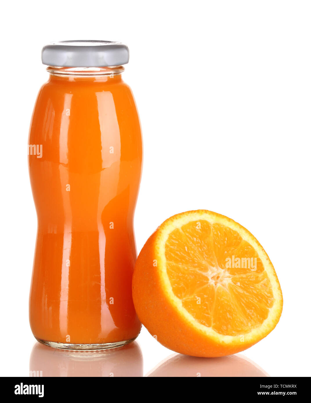 Delicious orange juice in a bottle and orange next to it isolated on ...