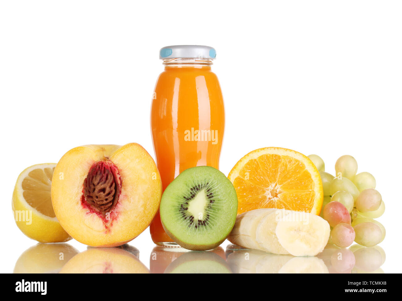 Delicious multifruit juice in a bottle and fruit next to it isolated on ...