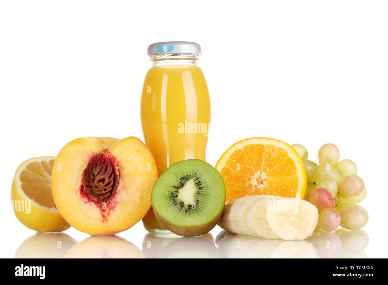 Delicious multifruit juice in a bottle and fruit next to it isolated on ...