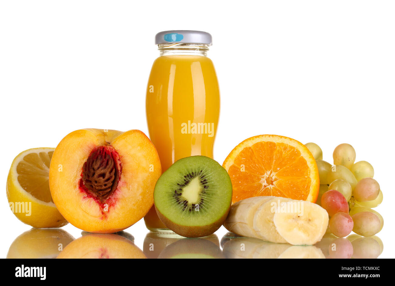 Delicious multifruit juice in a bottle and fruit next to it isolated on ...