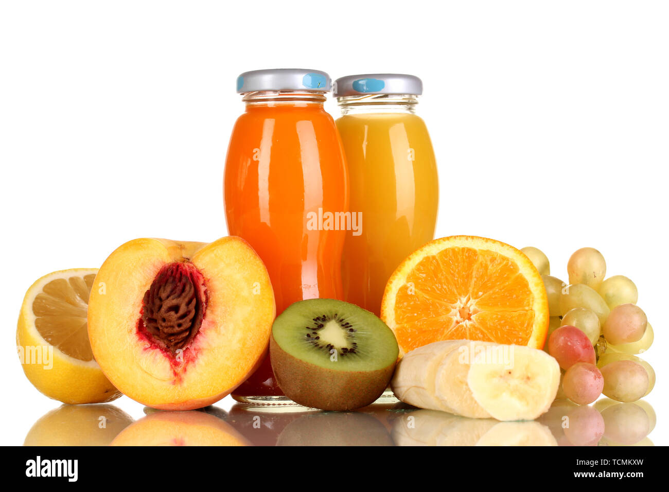 Delicious multifruit juice in a bottle and fruit next to it isolated on ...