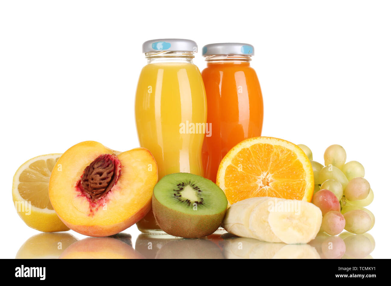 Delicious multifruit juice in a bottle and fruit next to it isolated on ...