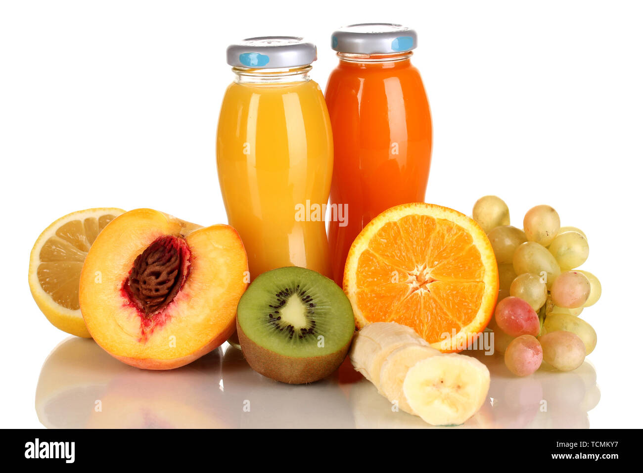 Delicious multifruit juice in a bottle and fruit next to it isolated on ...