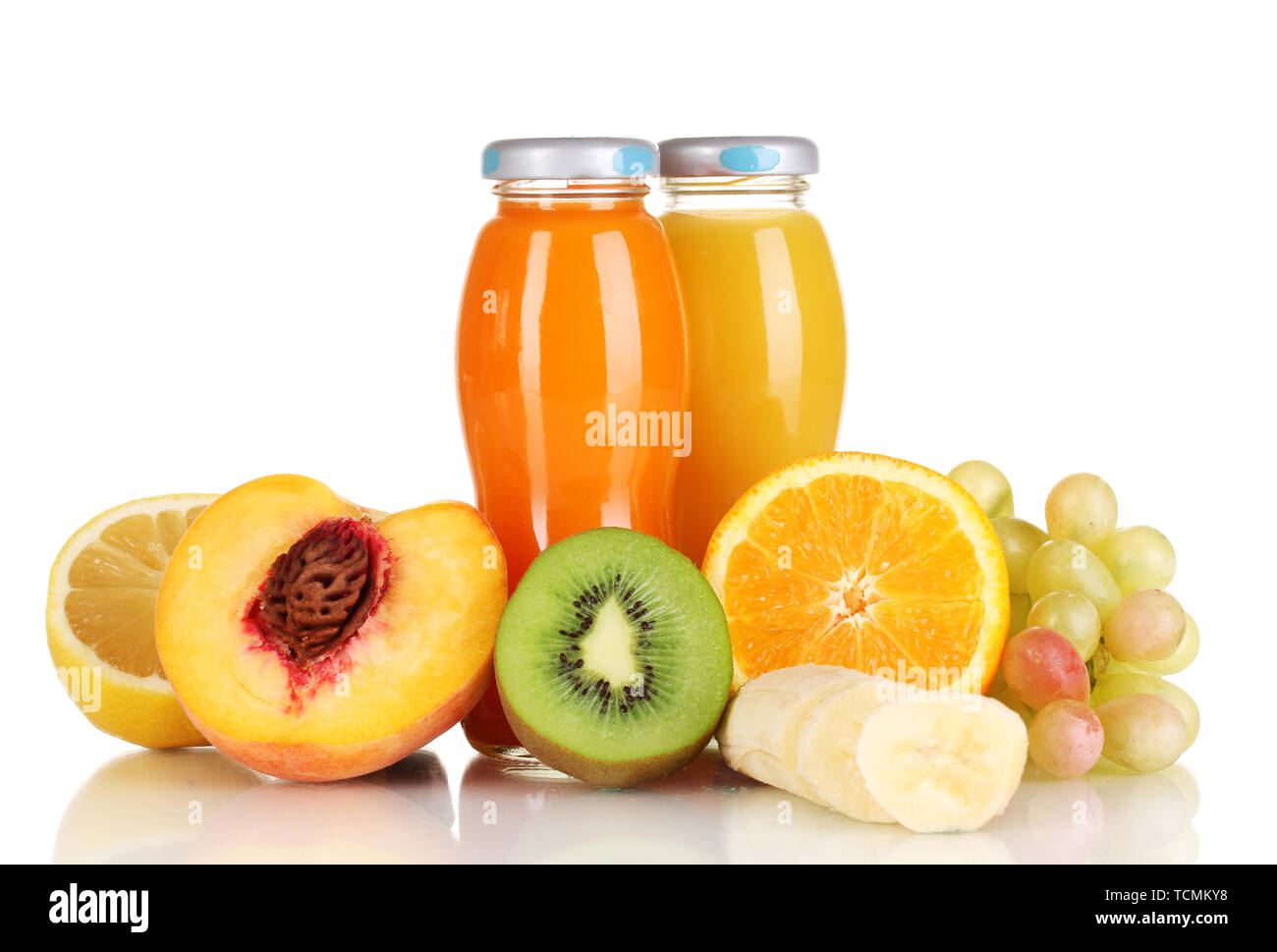 Delicious multifruit juice in a bottle and fruit next to it isolated on ...