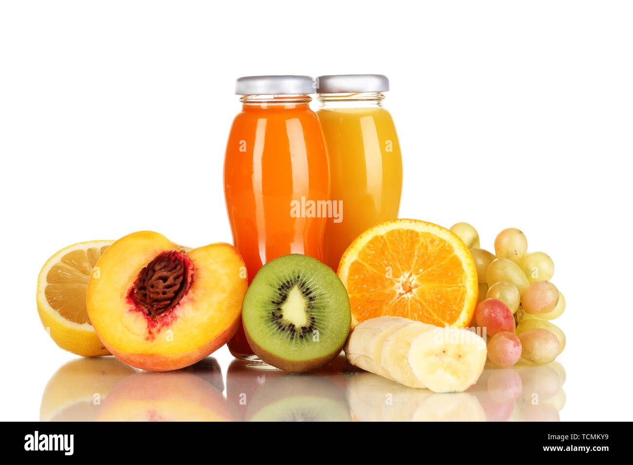 Delicious multifruit juice in a bottle and fruit next to it isolated on ...