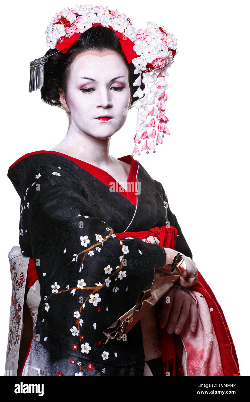 young pretty geisha in kimono with sakura and decoration. Portrait of a ...