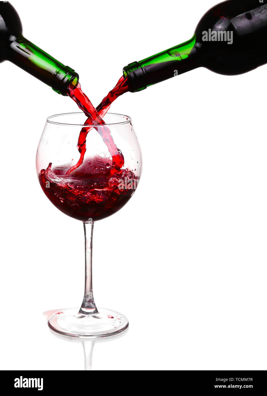 Red wine pouring on white background Stock Photo - Alamy