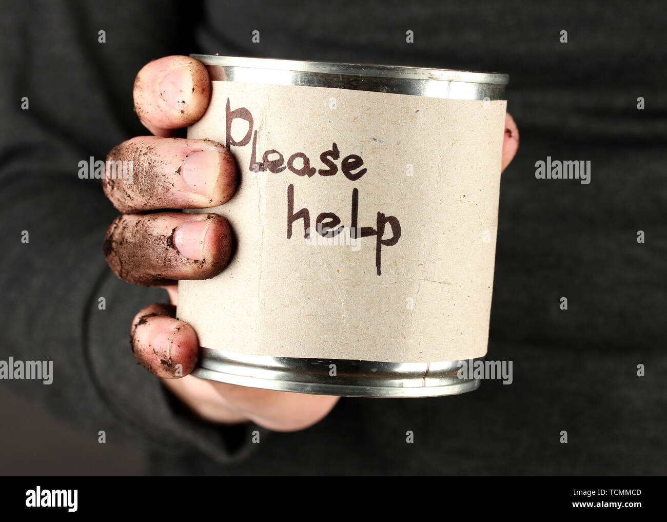 homeless man asks for help, on black background close-up Stock Photo ...
