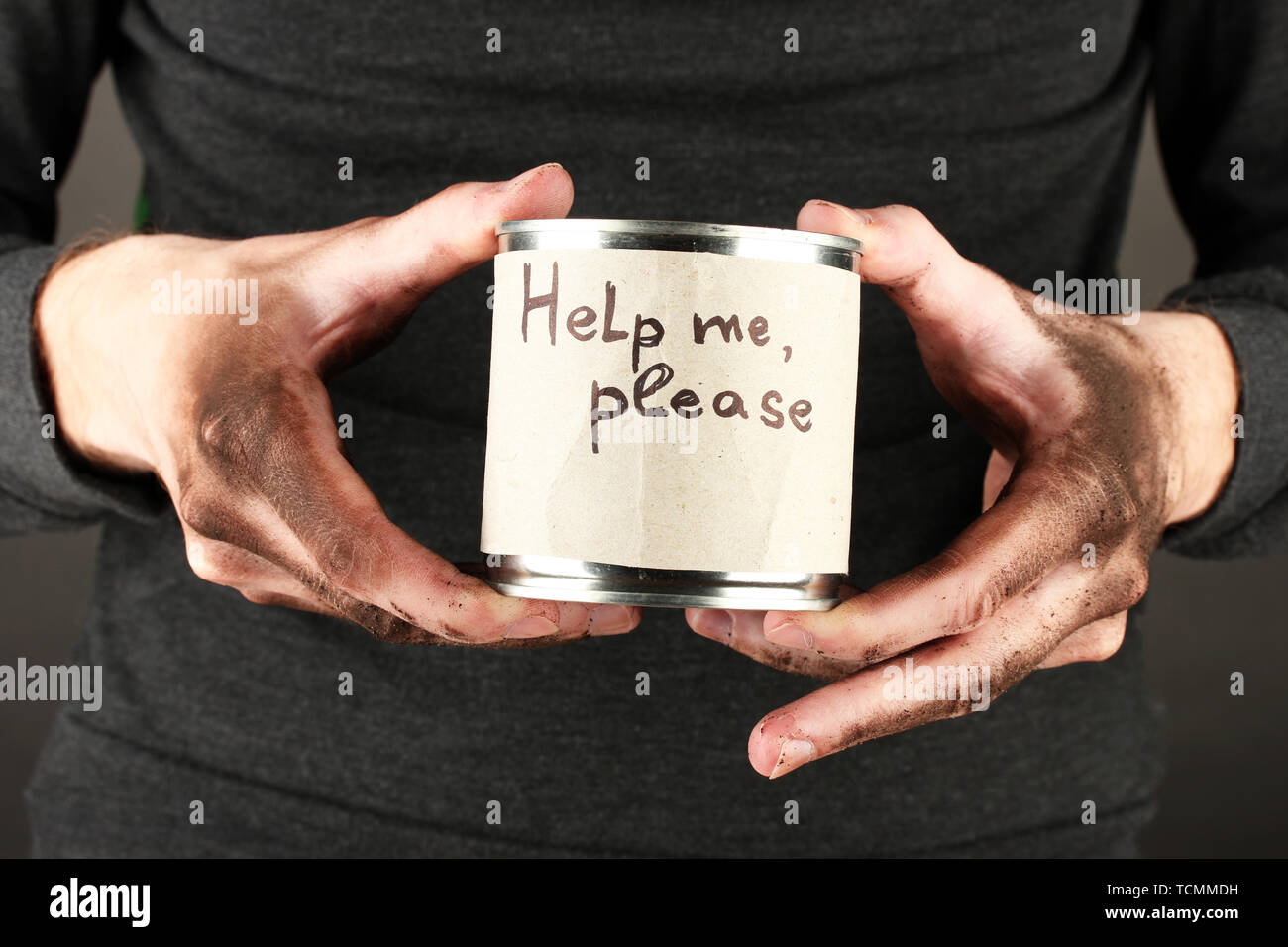 homeless man asks for help, on black background close-up Stock Photo ...