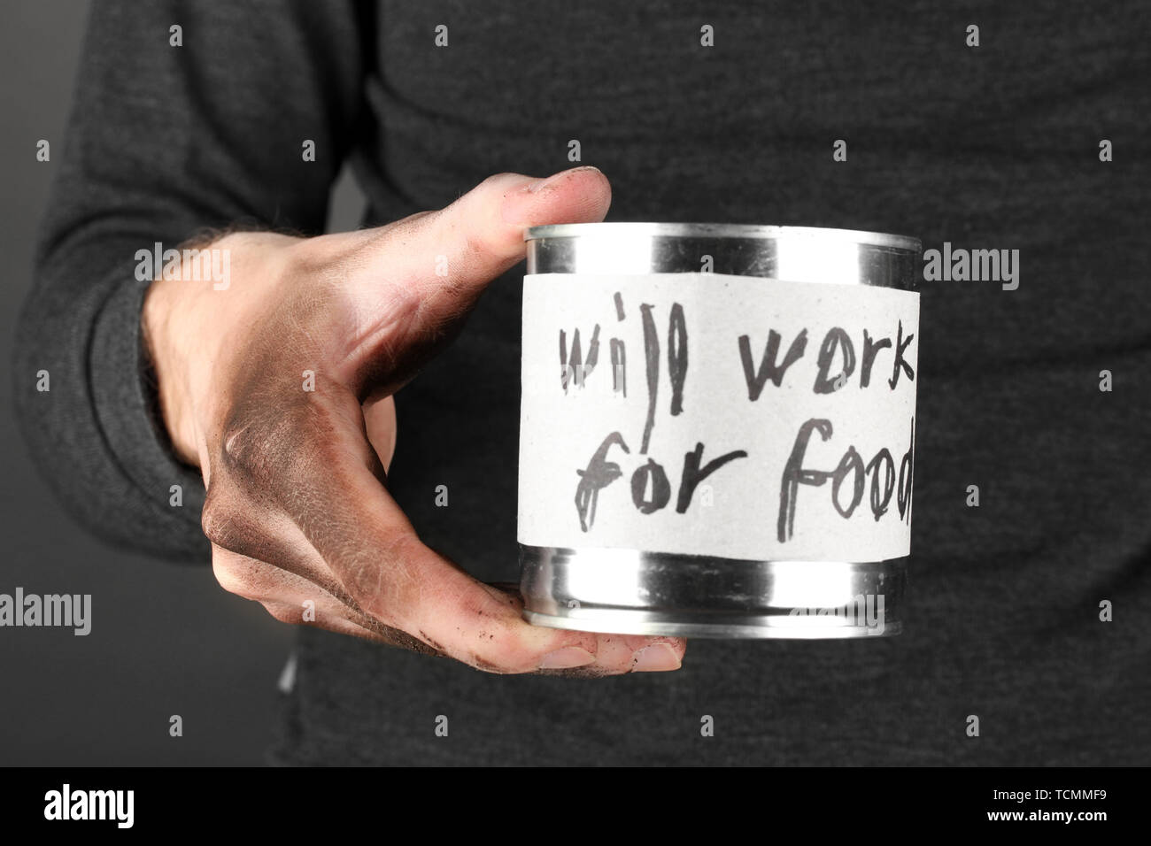 homeless man asks for help, on black background close-up Stock Photo ...