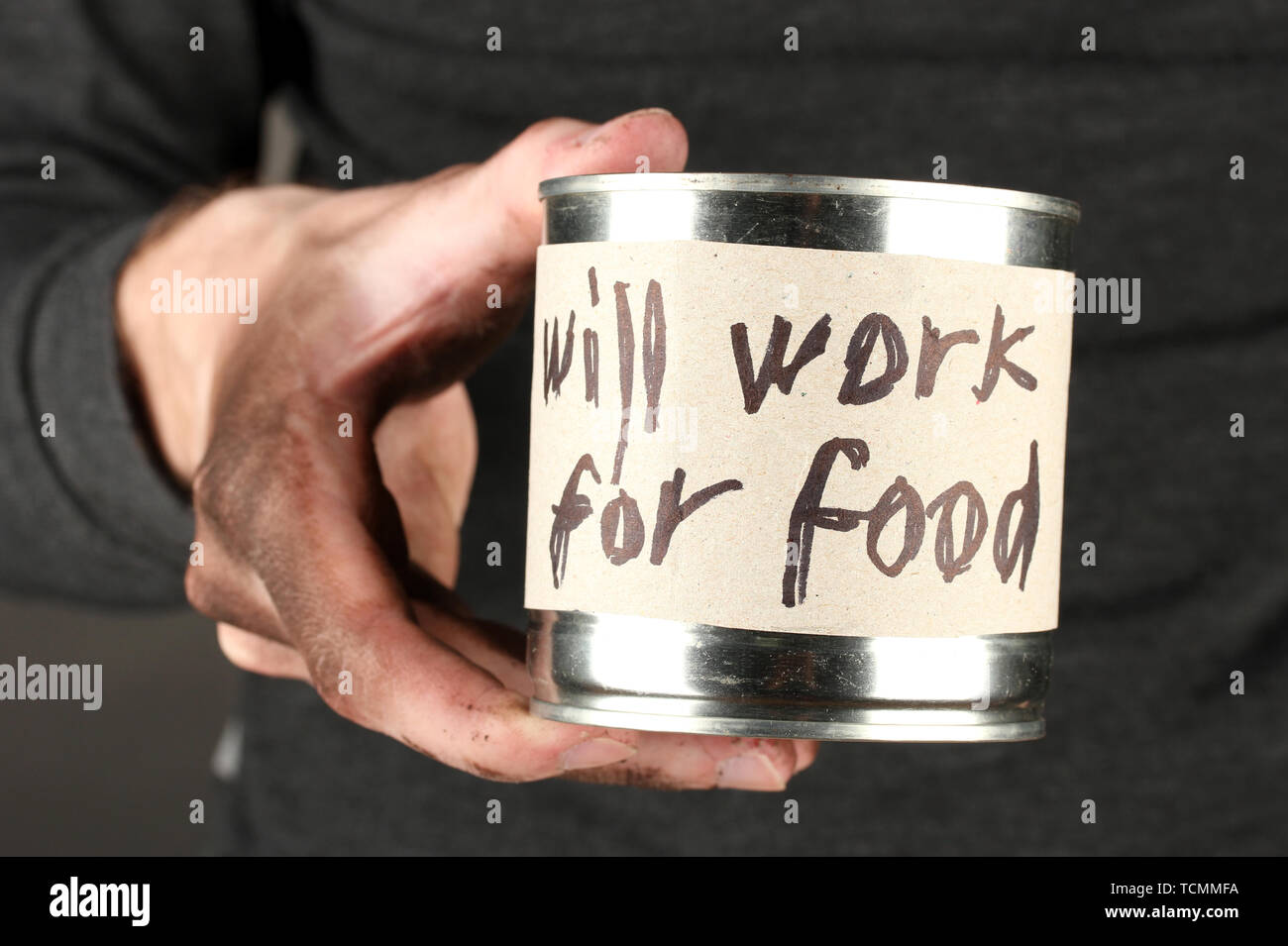 homeless man asks for help, on black background close-up Stock Photo ...