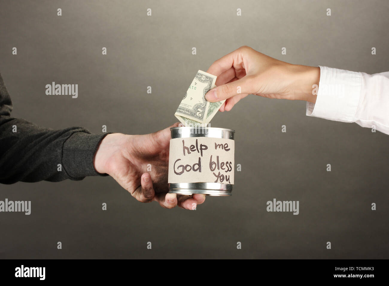 helping the homeless, on black background close-up Stock Photo - Alamy