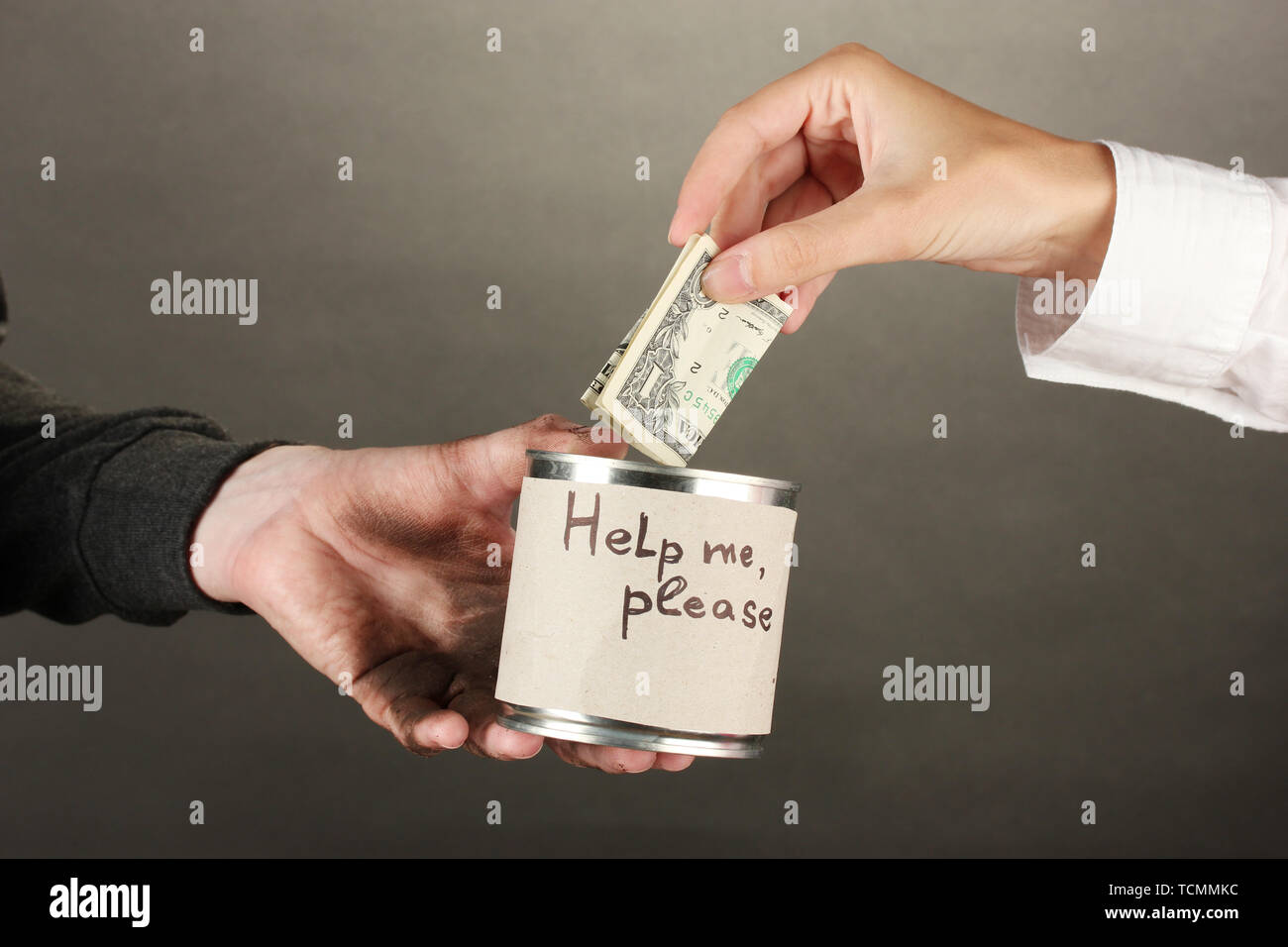 helping the homeless, on black background close-up Stock Photo - Alamy