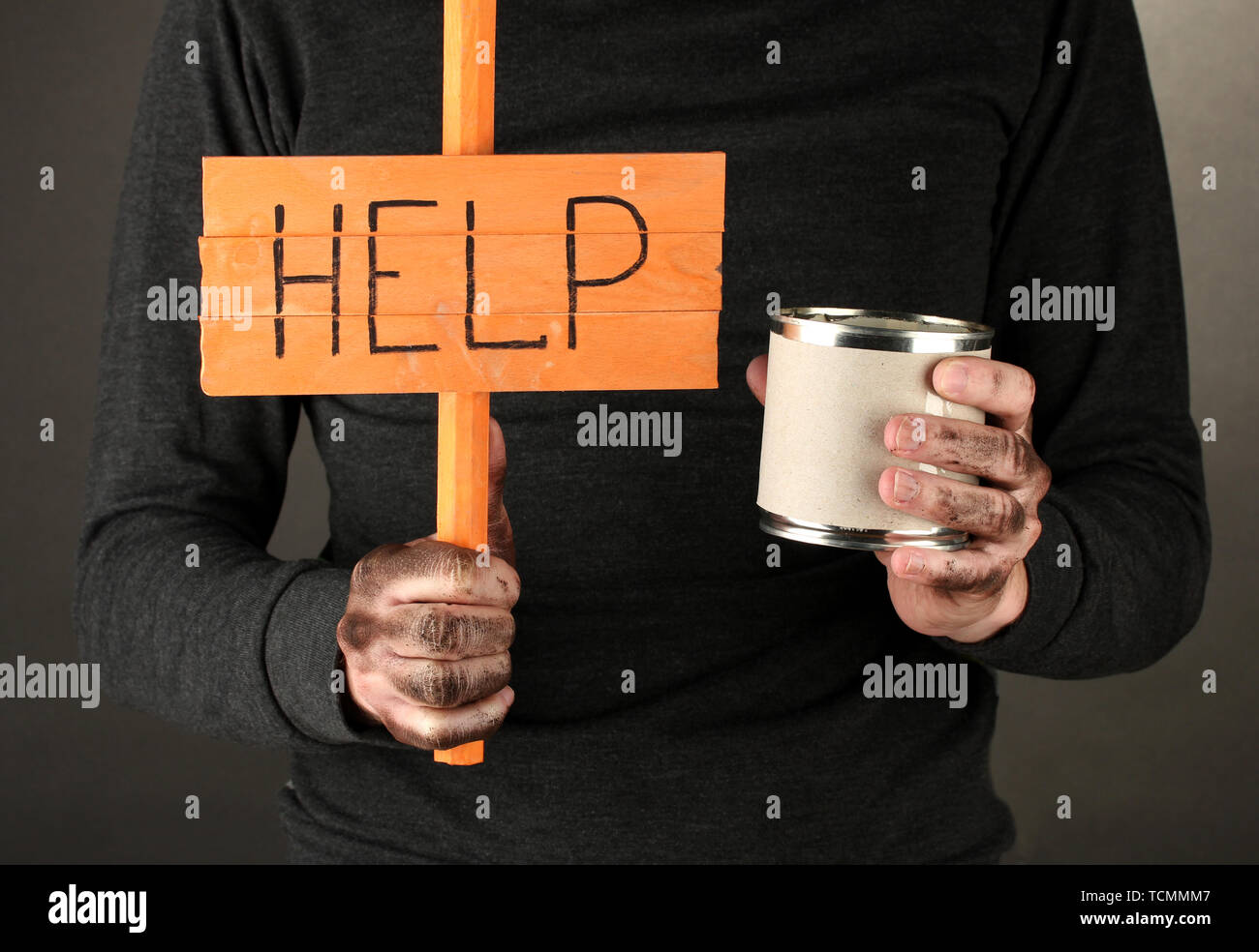 homeless man asks for help, on black background close-up Stock Photo ...