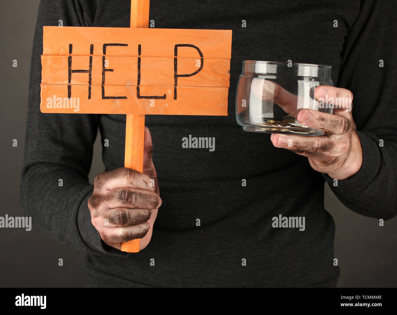 homeless man asks for help, on black background close-up Stock Photo ...
