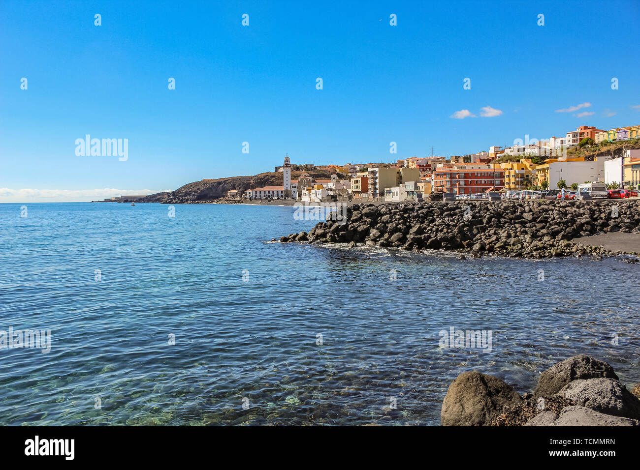 The town of Candelaria with its black sand beach and the basilica in ...