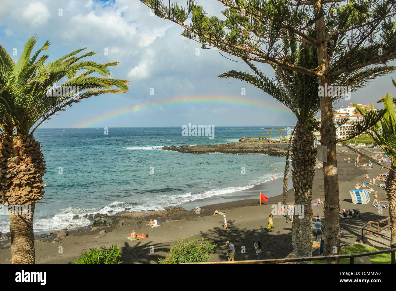 View of the Playa de la Arena and rainbow over the sea, the phenomenon ...