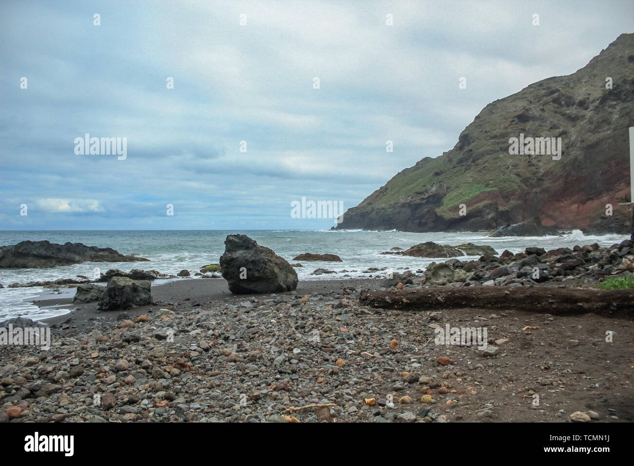 Steep high lava rock cliffs on on the east of Tenerife. Solitary rocks ...