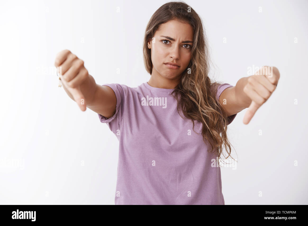 Waist-up judgemental displeased young woman grimacing disappointed ...