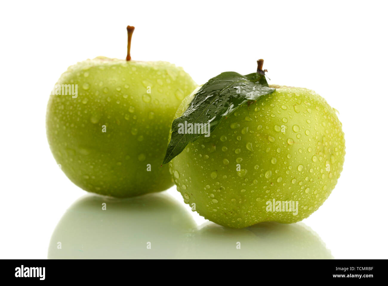 Ripe green apples isolated on white Stock Photo - Alamy