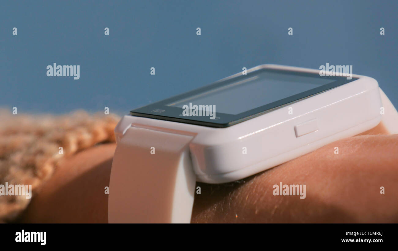 Woman using wearable smart watch Stock Photo - Alamy