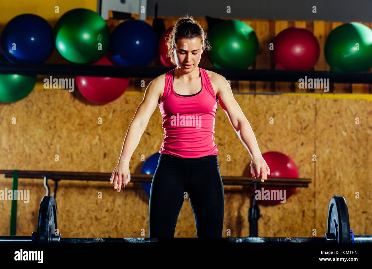 Strong girl is having gym workout routine Stock Photo - Alamy