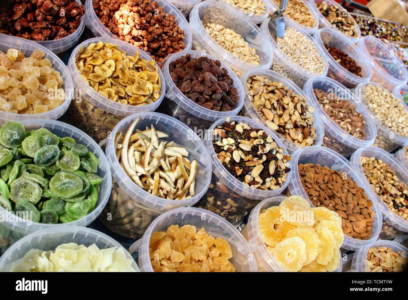 Variety of nuts in containers exposed in the market Stock Photo - Alamy