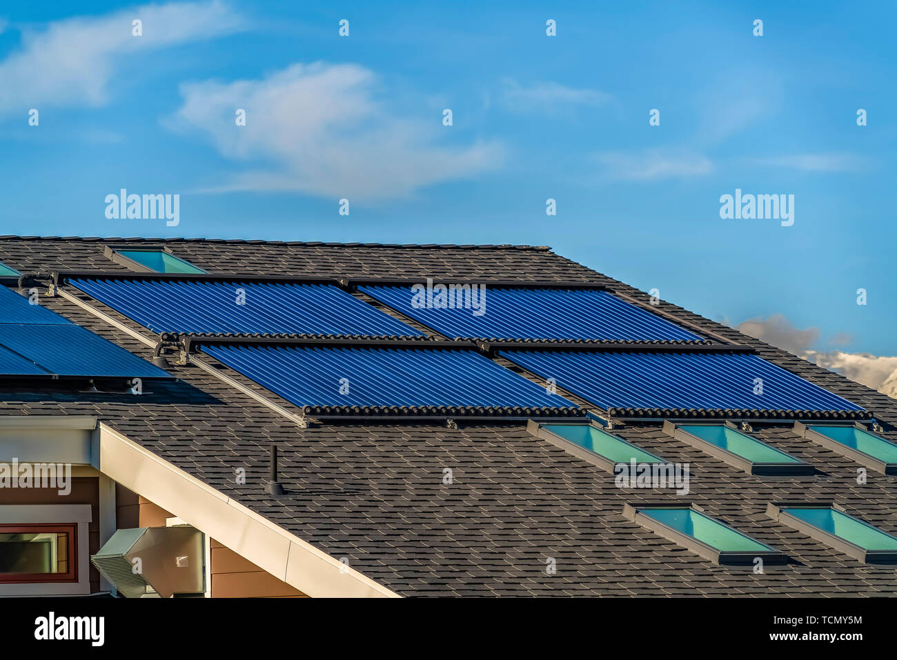Pitched roof with solar water heater solar panels and skylights Stock ...