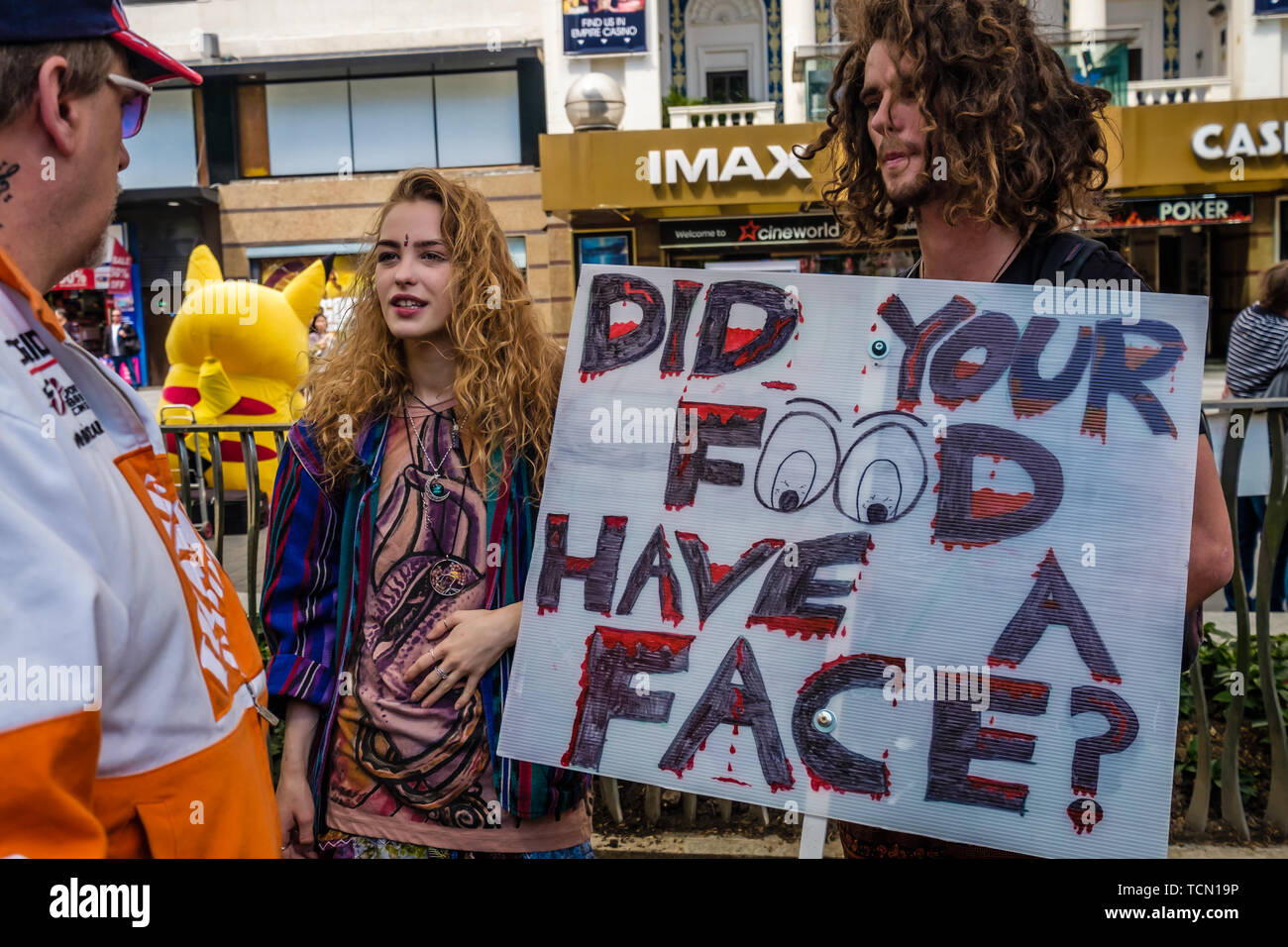 Young people handing out leaflets hi-res stock photography and images ...
