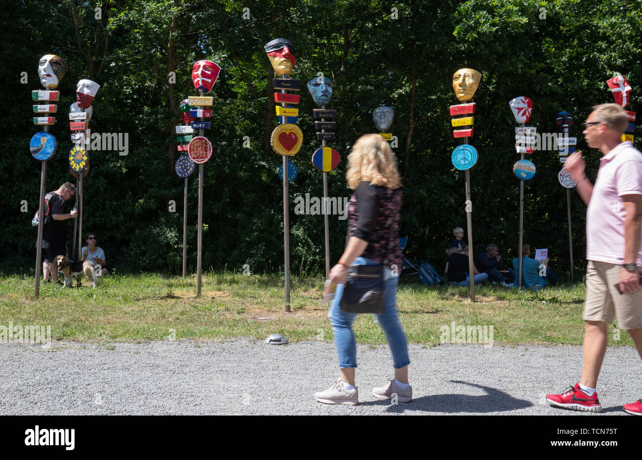 Bramsche, Germany. 09th June, 2019. Visitors walk past steles with ...
