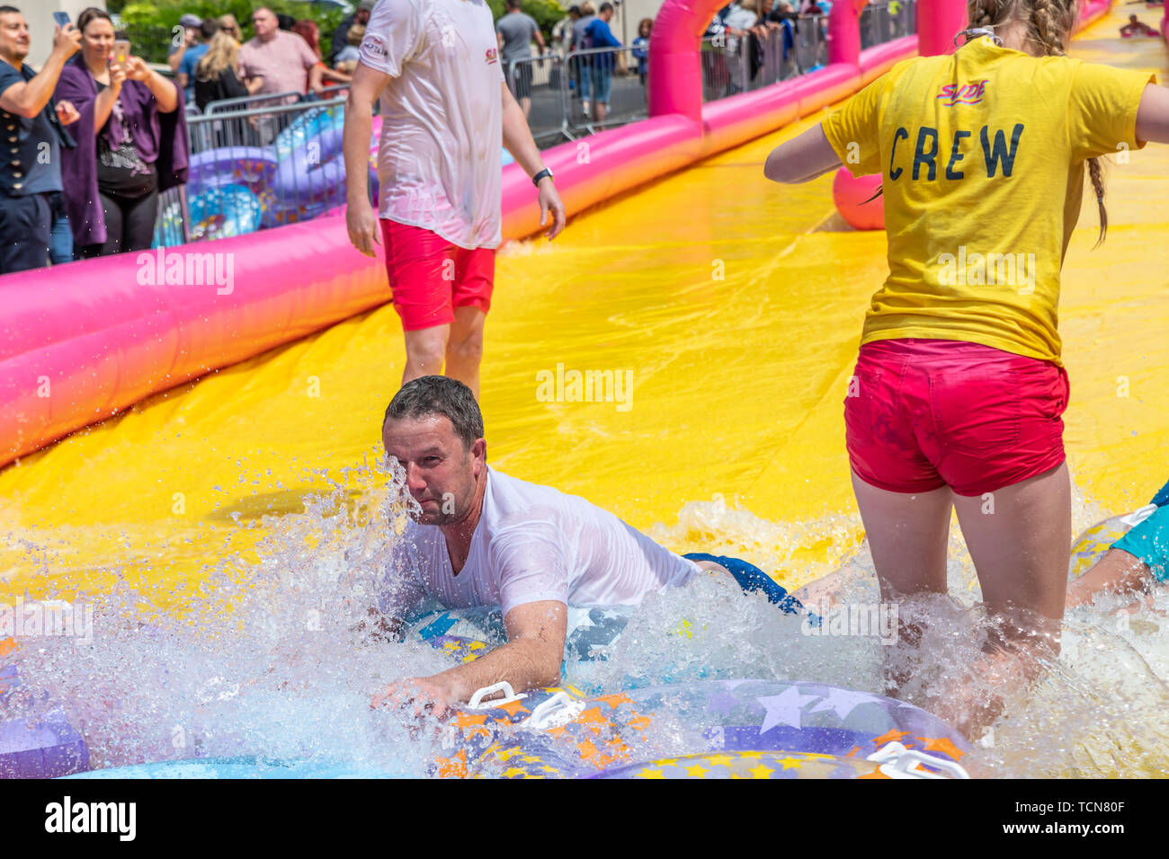 Bournemouth, Dorset, UK. 9th June 2019. Thrill seekers take turns to ...