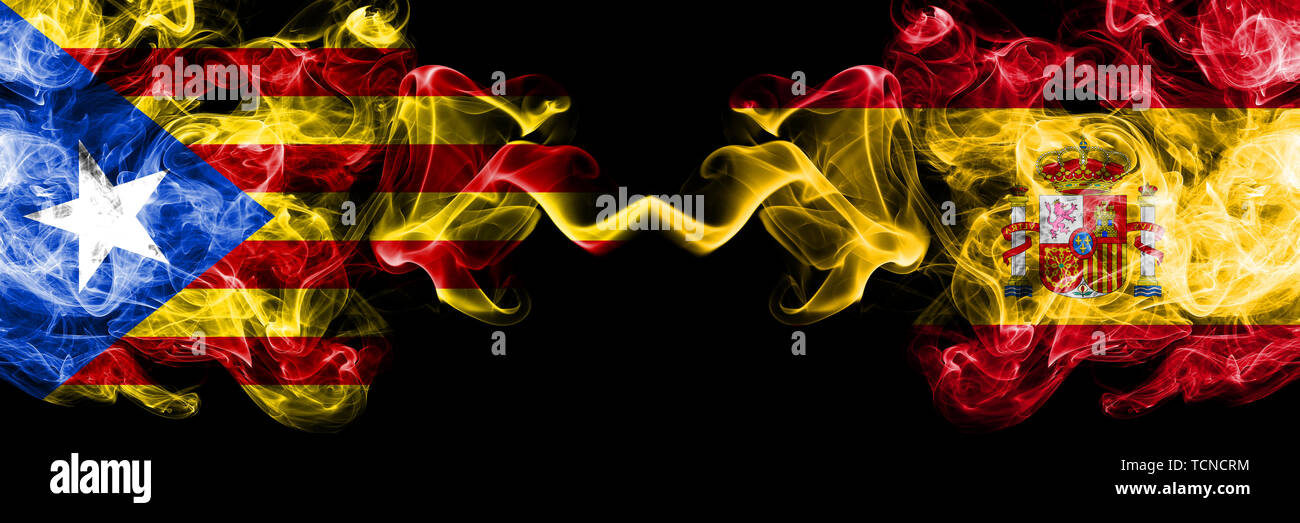 Catalonia vs Spain, Spanish smoke flags placed side by side. Thick ...
