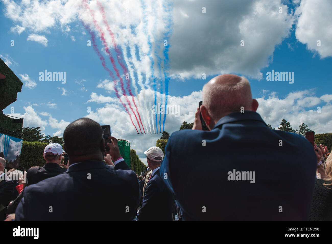 Spectators watch as French aircraft conduct a fly-over at the 75th ...