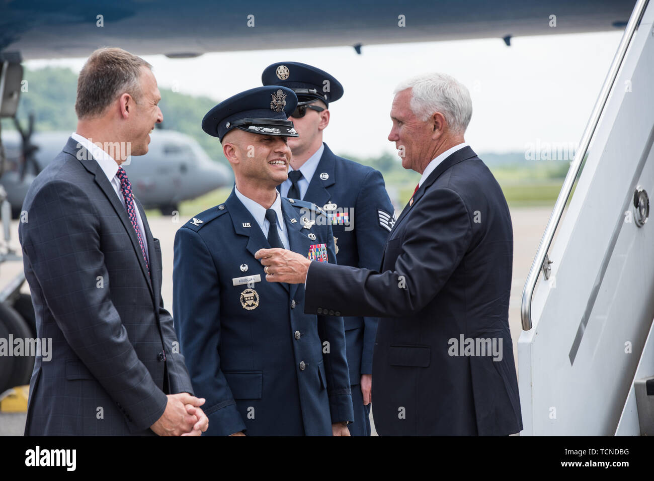 Vice President Mike Pence speaks with U.S. Rep. Scott Perry, left, and ...