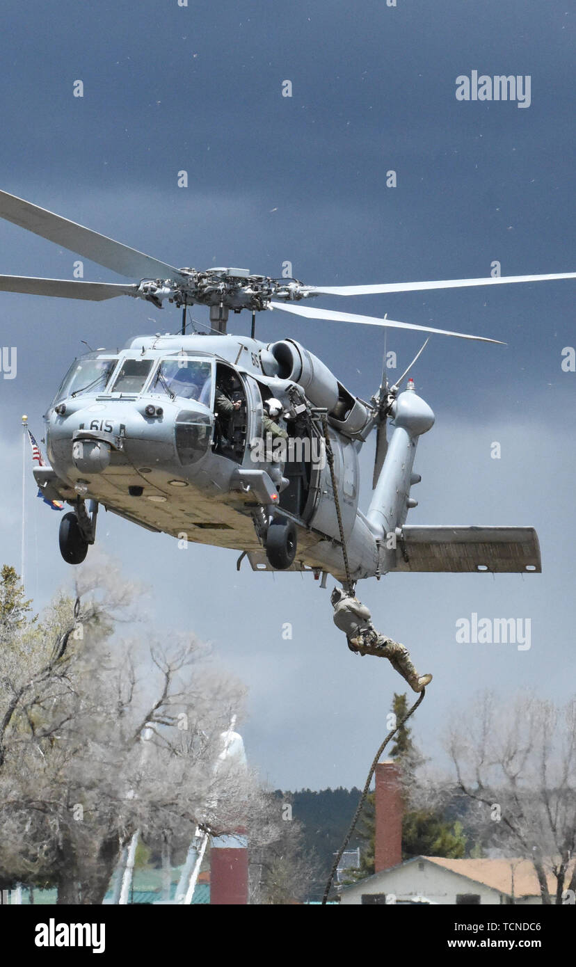 A Soldier assigned to 7th Special Forces Group rehearses fast-roping ...
