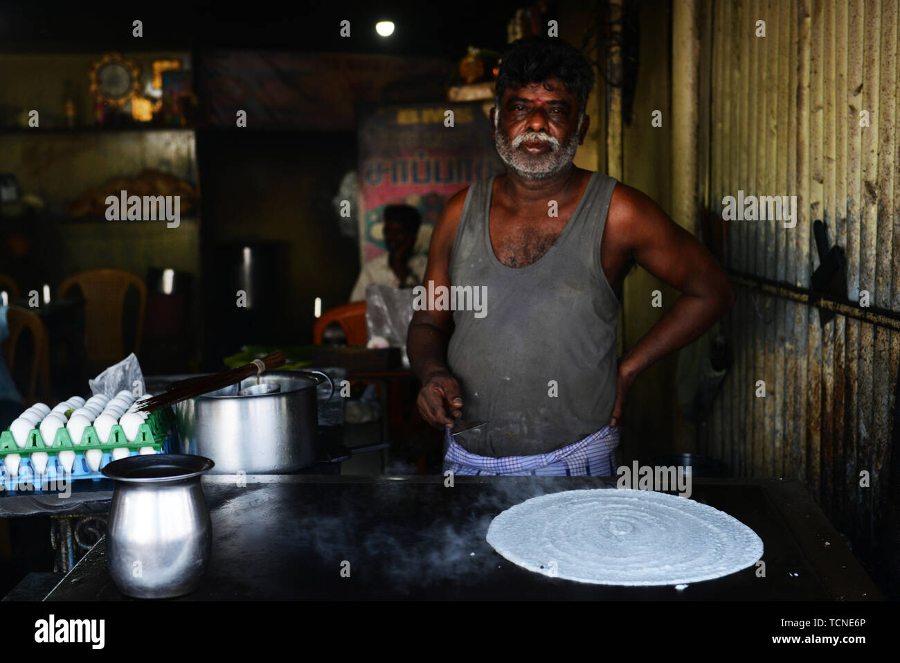 A Tamil cook preparing a Dosa Stock Photo - Alamy