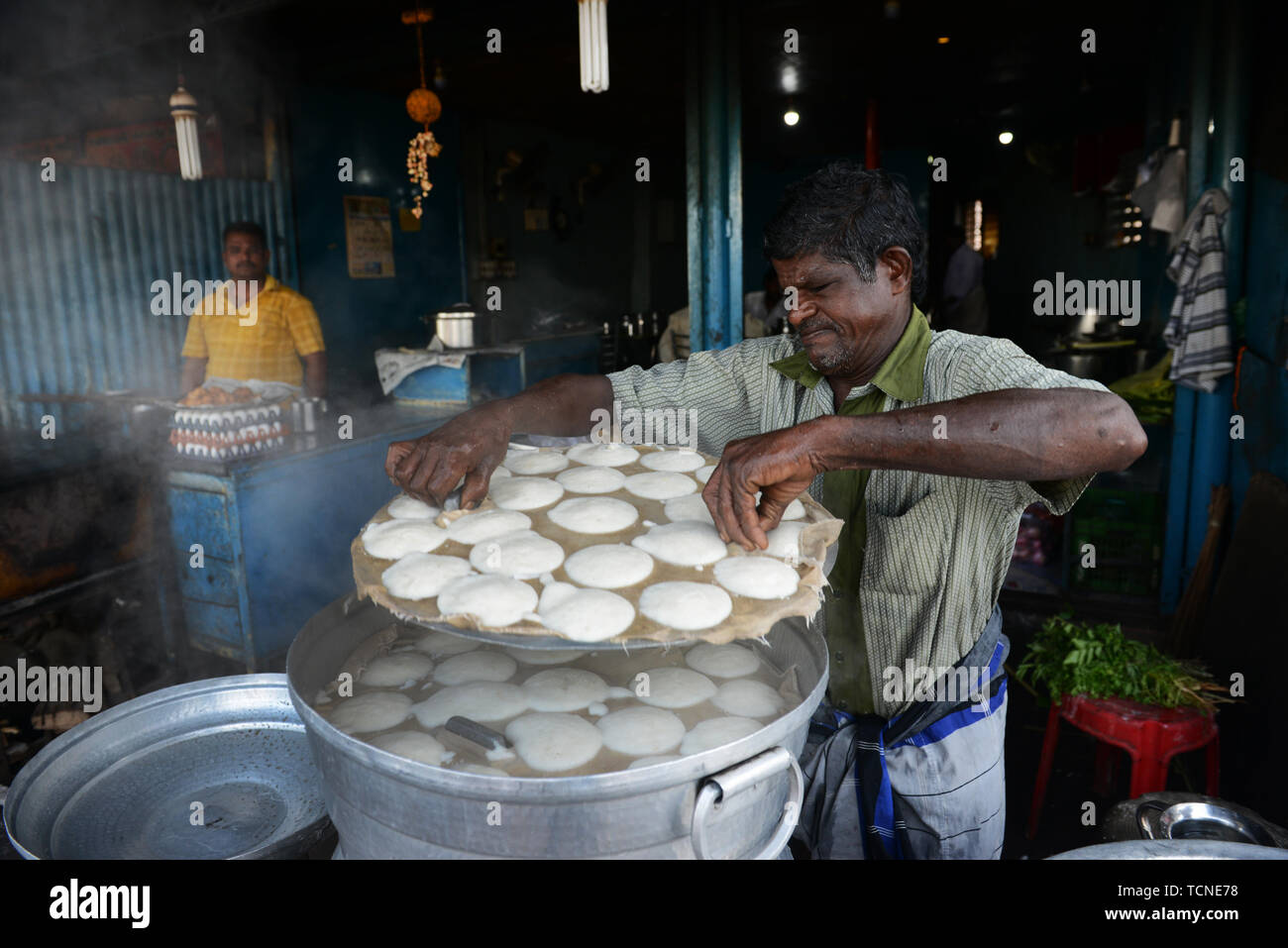 Idly ( savoury rice cake ) preparation Stock Photo - Alamy