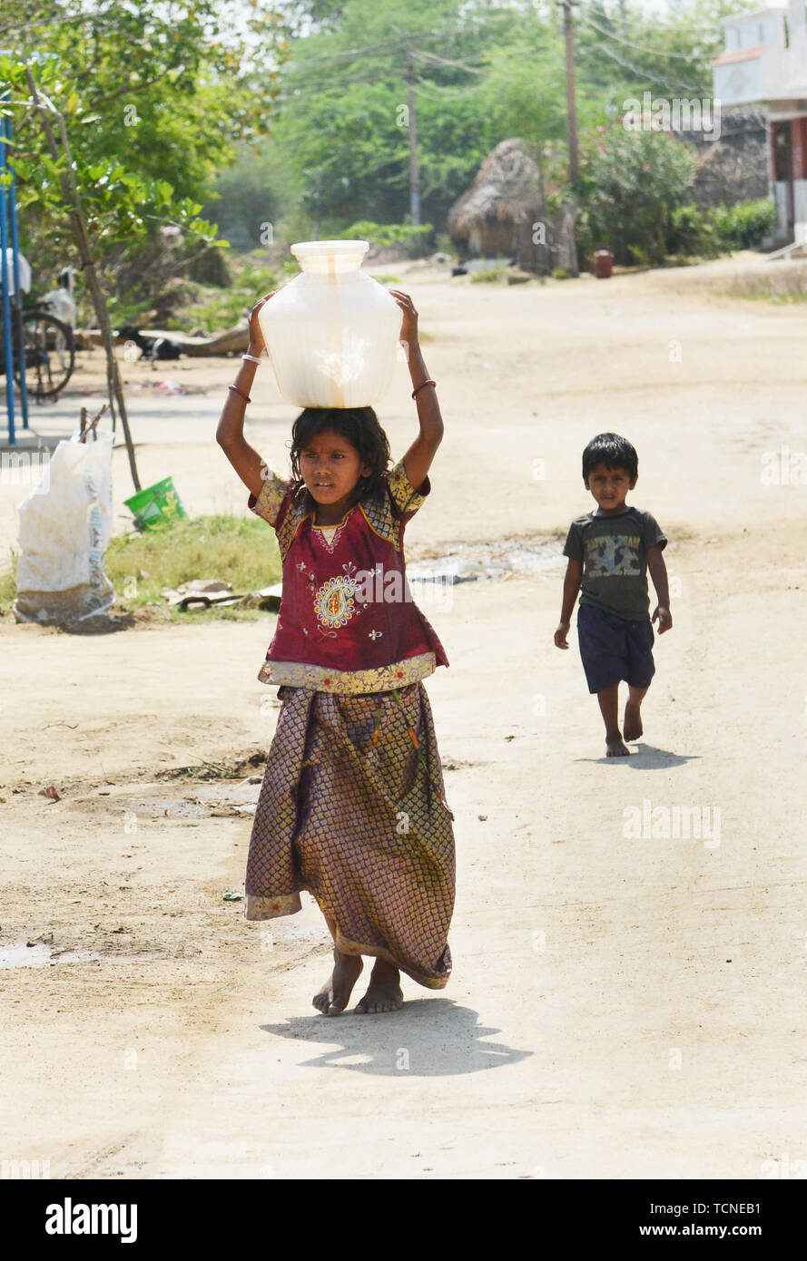 Girl carrying water hi-res stock photography and images - Alamy