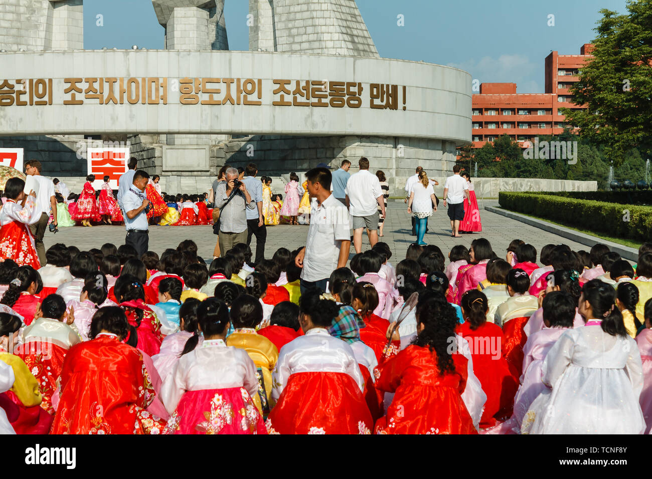 Pyongyang, North Korea - July 27, 2014: Korean people are sitting on ...