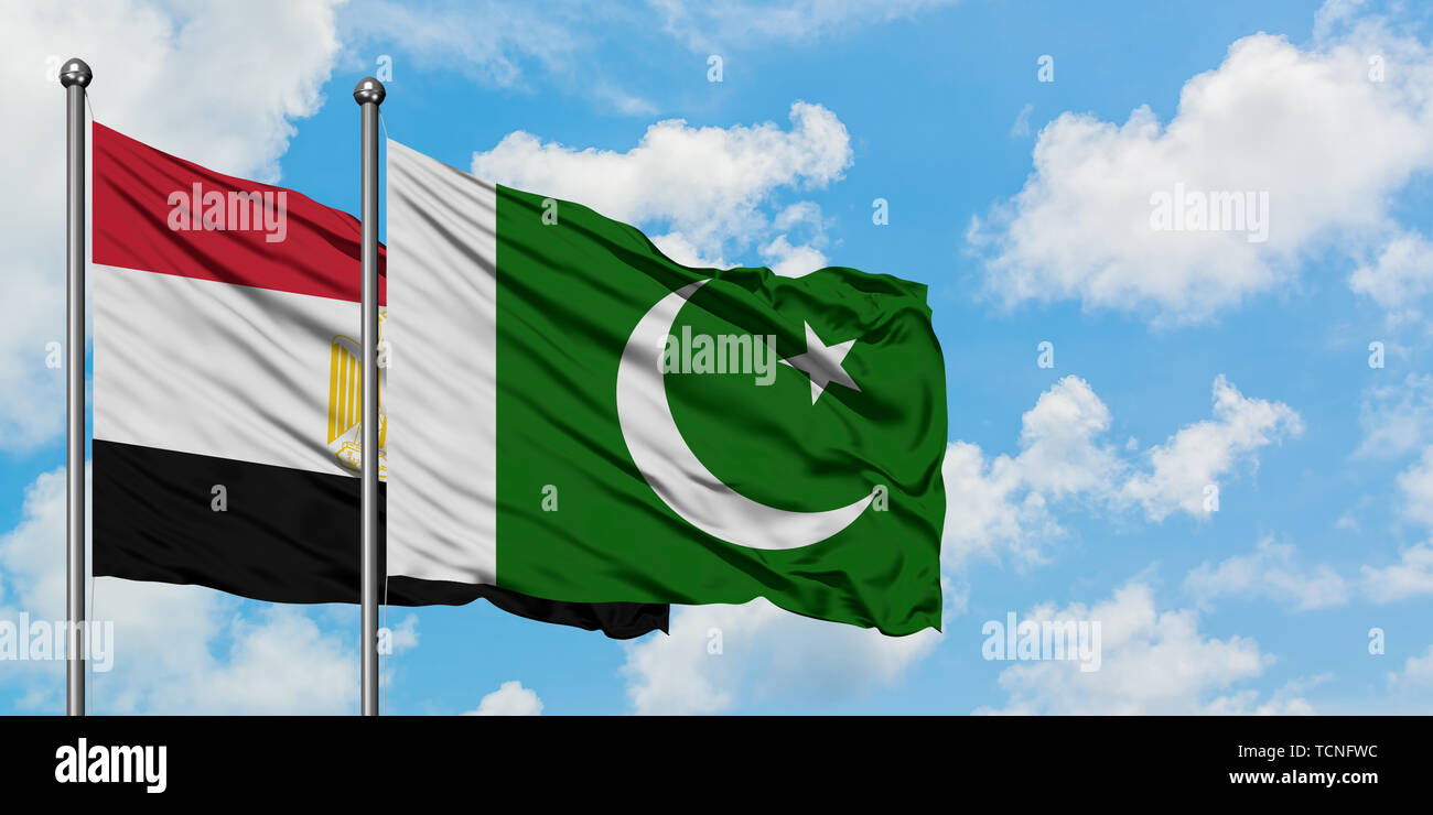 Egypt and Pakistan flag waving in the wind against white cloudy blue ...