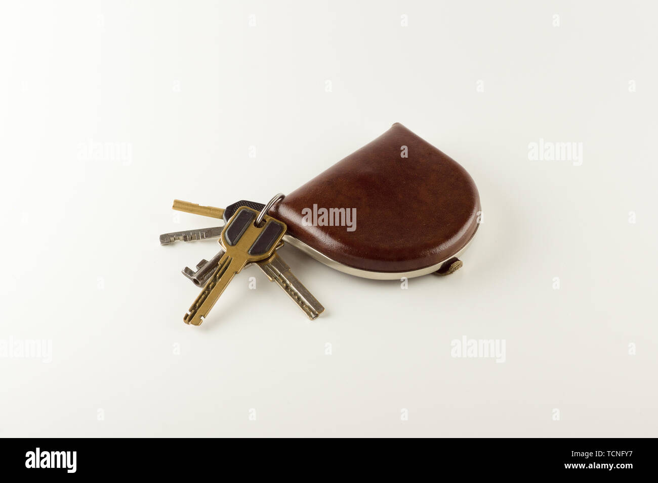 apartment keys and leather wallet with small coins Stock Photo - Alamy