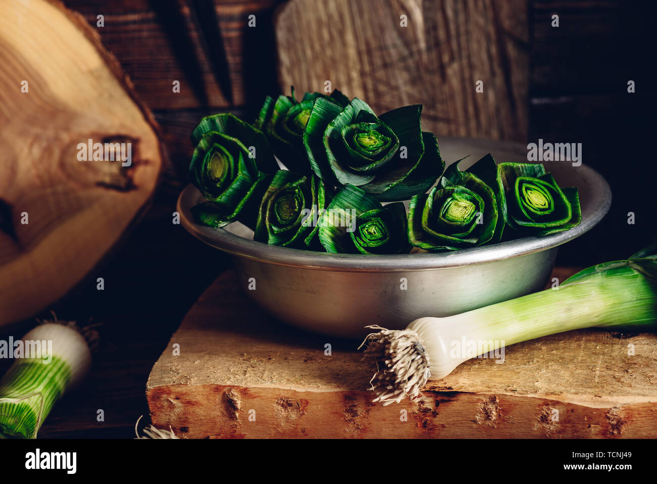 Fresh leek in a metal bowl on rustic kitchen Stock Photo - Alamy