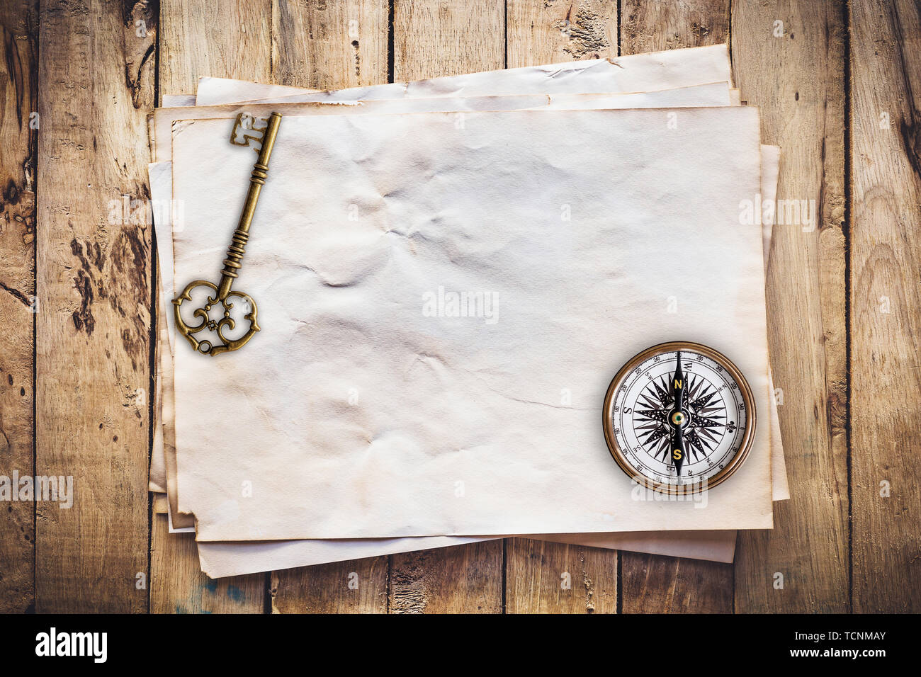 Old key and Compass on Old paper vintage on wood background with space ...