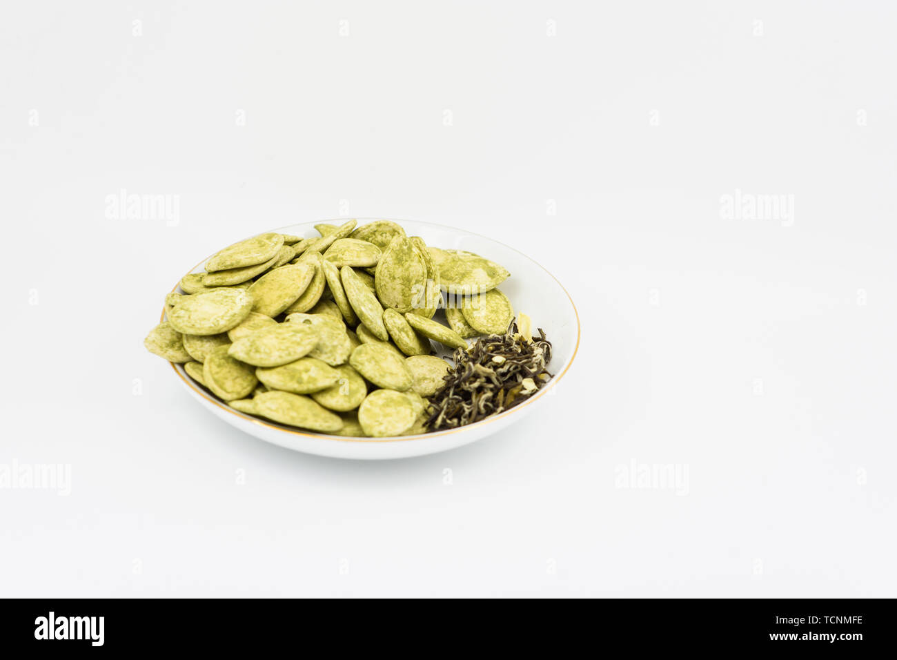 Matcha pumpkin seeds material background picture Stock Photo - Alamy