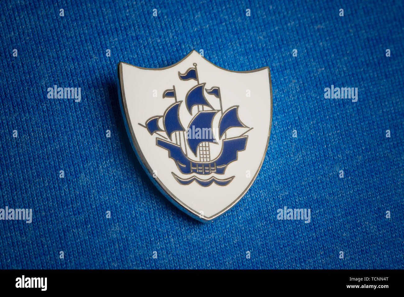 A vintage enamel Blue Peter badge from the 1970s and 1980s shot on a ...