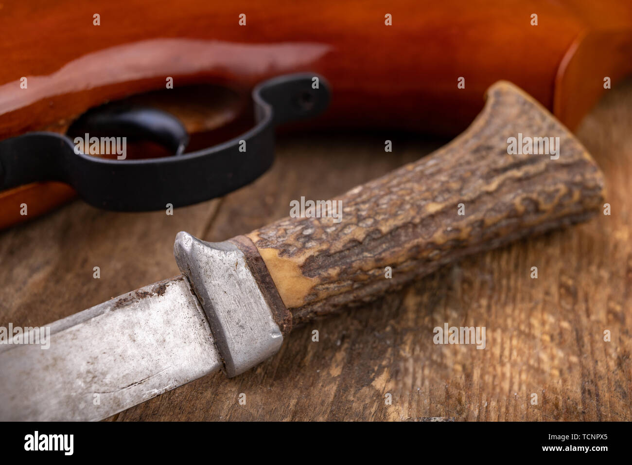 Old little dirty hunter's knife and firearm. Hunting accessories needed ...