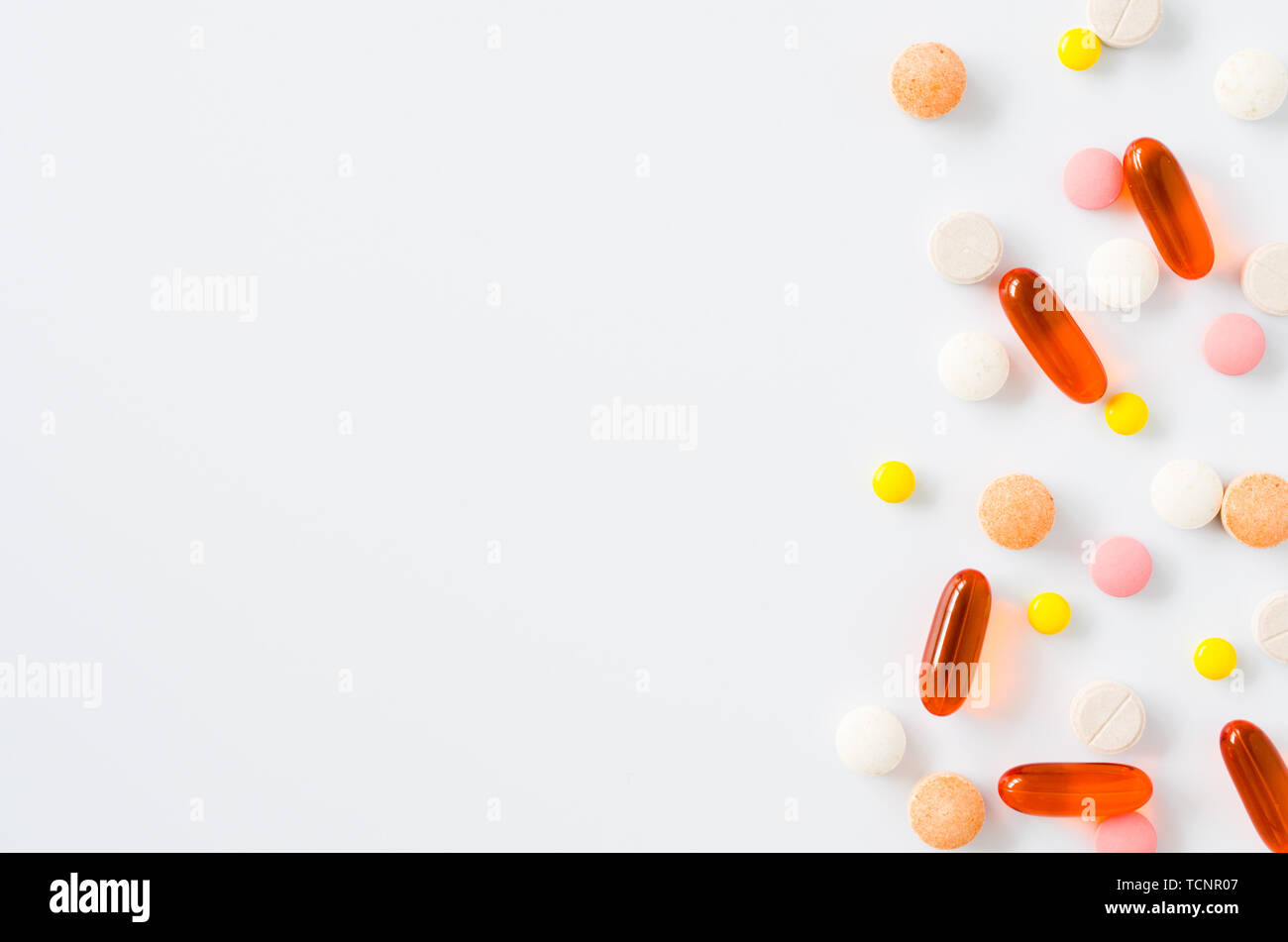 Assorted colorful tablets, pills, drugs isolated on white background ...