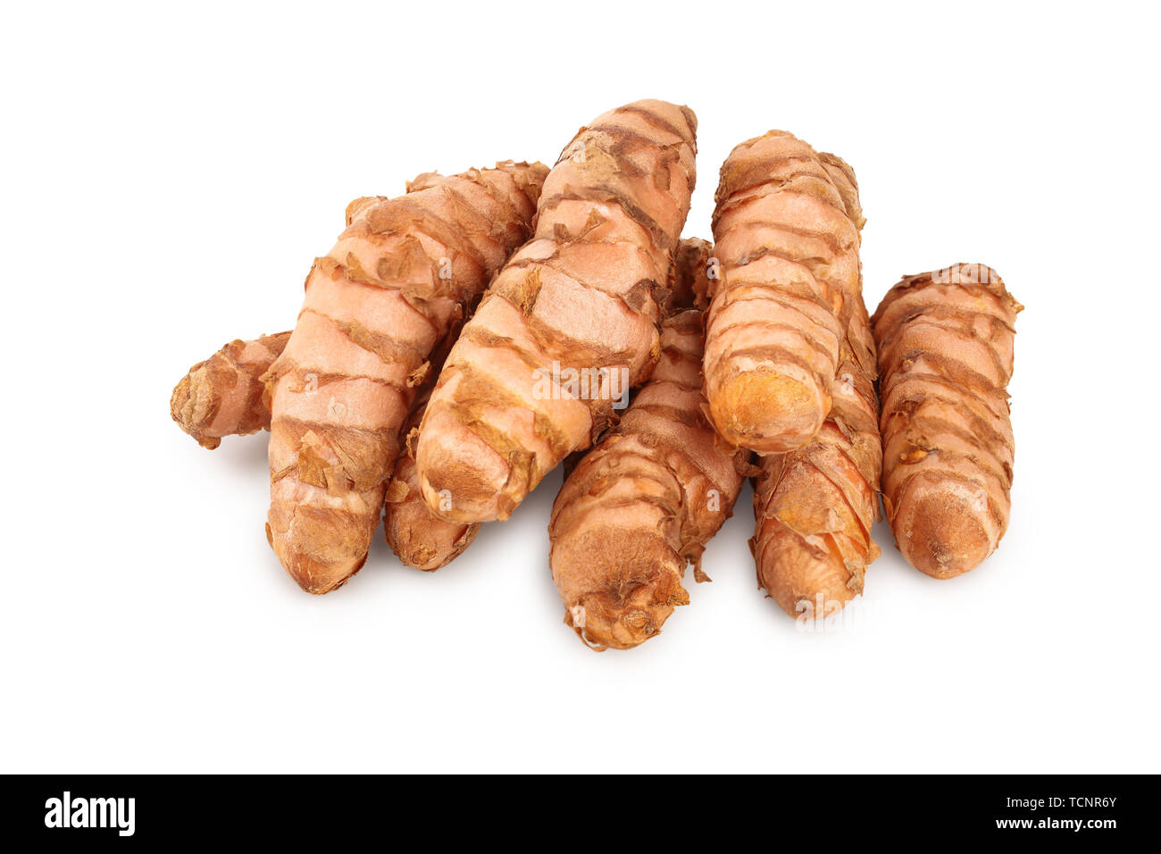 turmeric root isolated on white background close up Stock Photo - Alamy