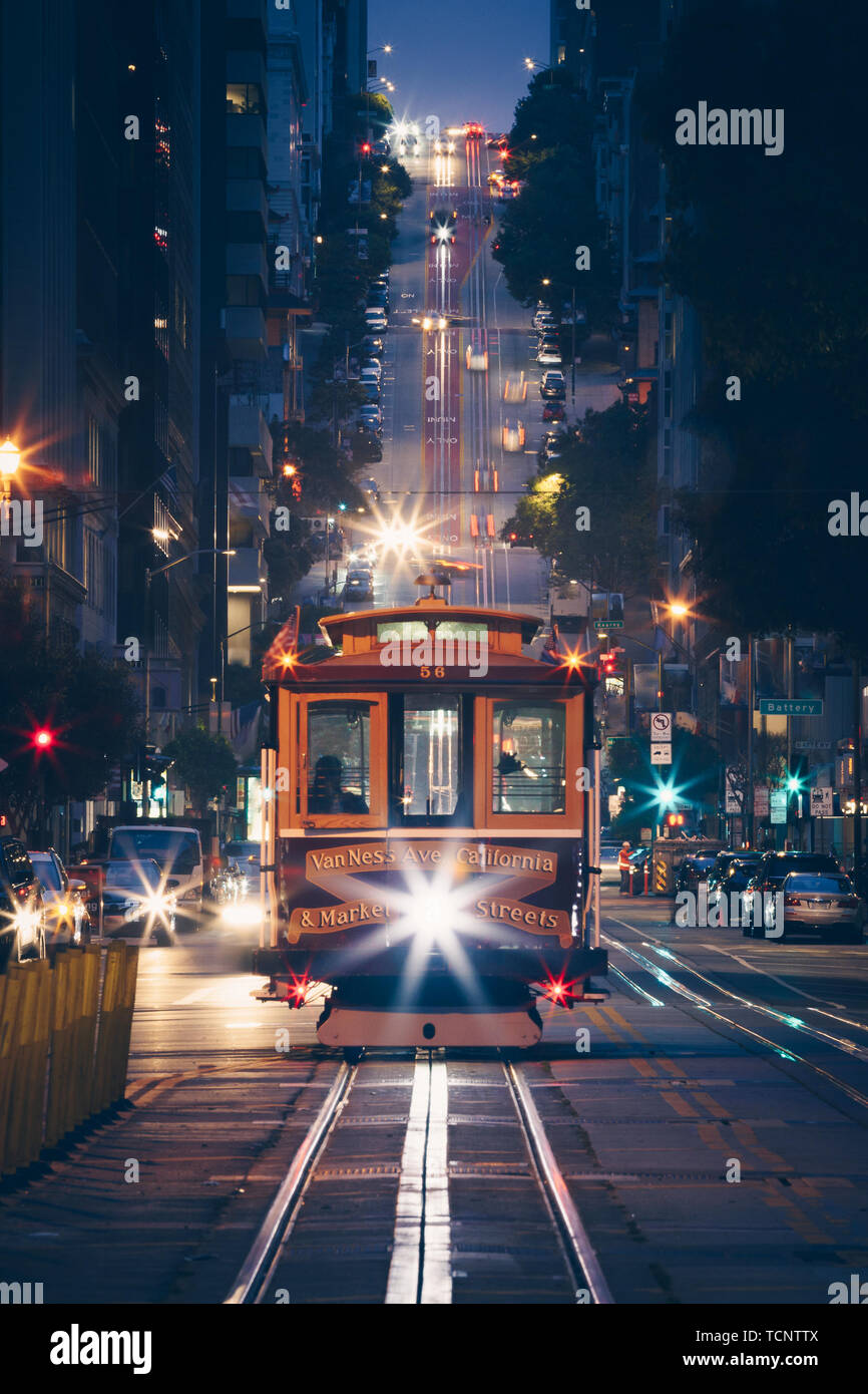 Classic view of historic traditional Cable Cars riding on famous ...