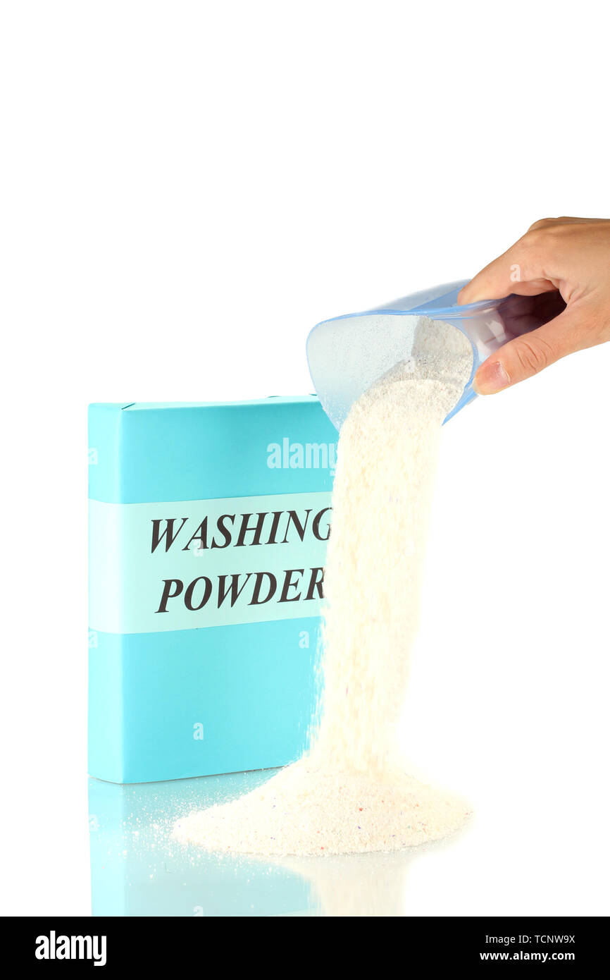woman's hand pours out of washing powder measuring cup, on white ...